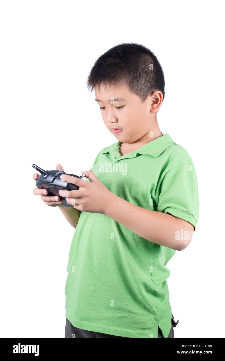 Little boy holding a radio remote control (controlling handset) for ...