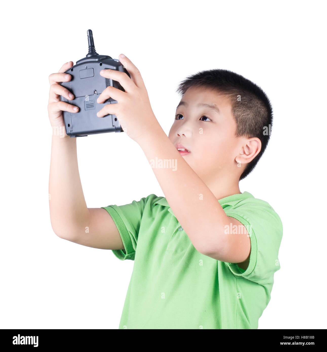 Little boy holding a radio remote control (controlling handset) for ...