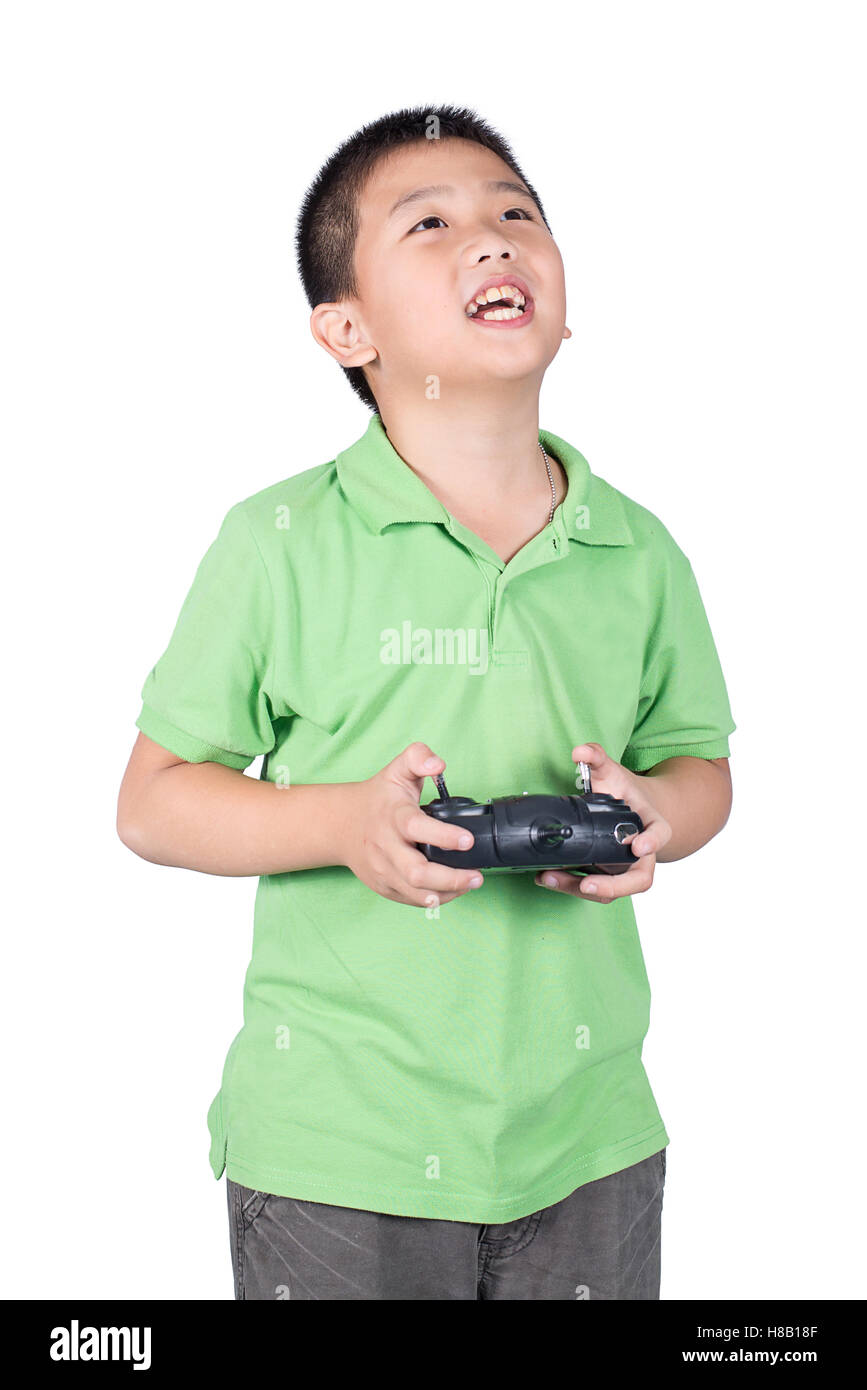 Little boy holding a radio remote control (controlling handset) for ...