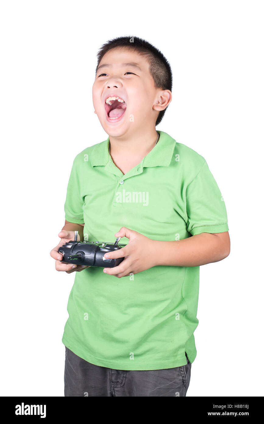 Little boy holding a radio remote control (controlling handset) for ...