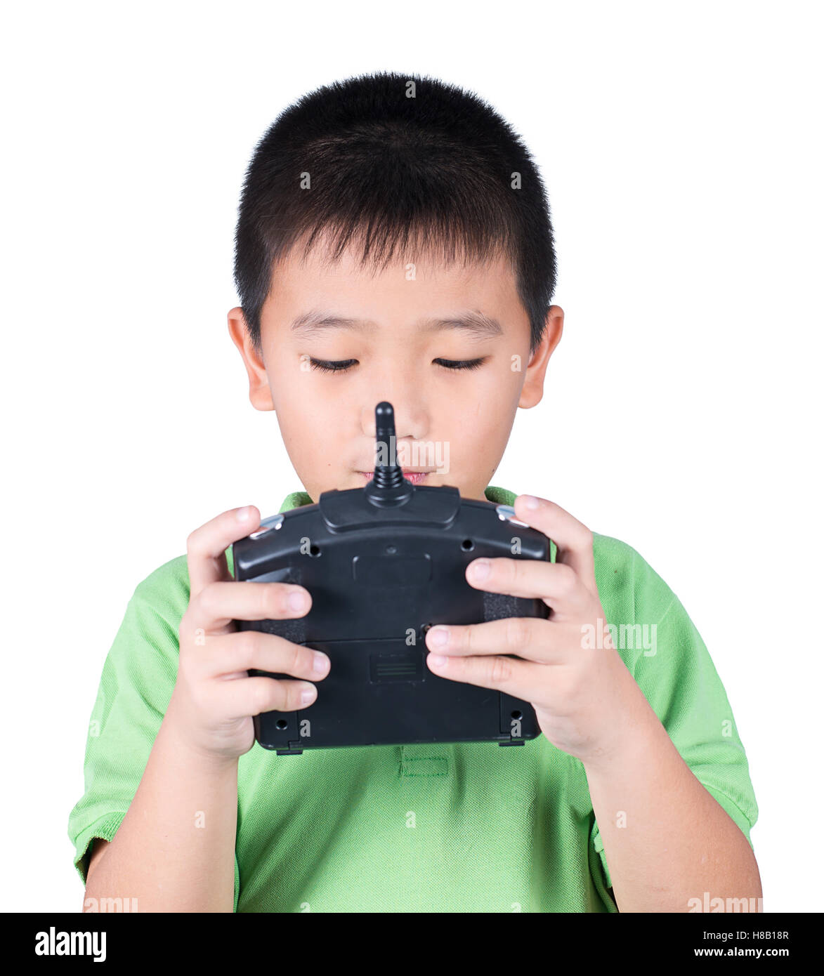 Little boy holding a radio remote control (controlling handset) for ...