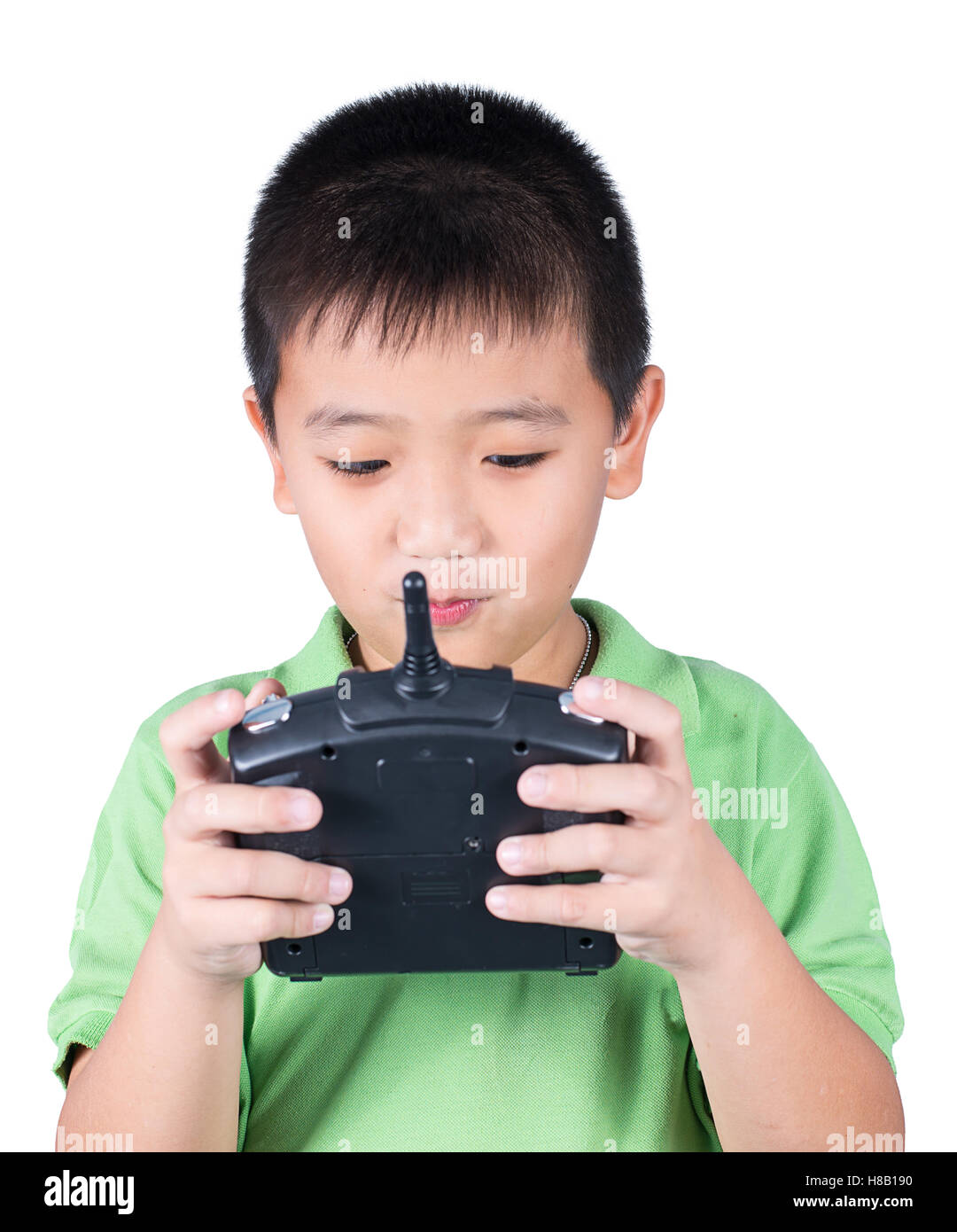 Little boy holding a radio remote control (controlling handset) for ...