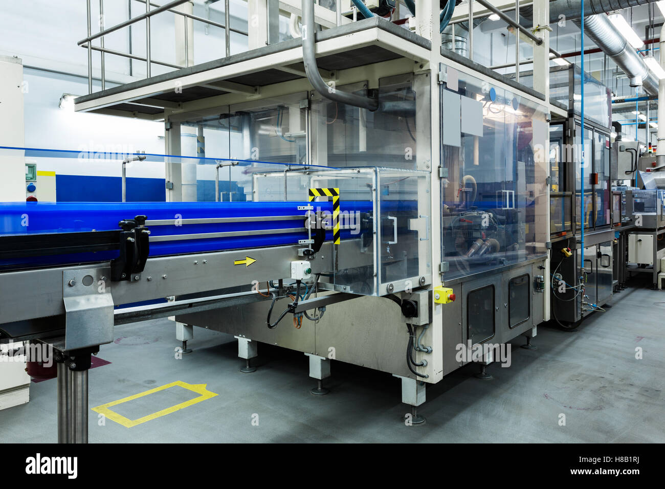 conveyor working at a modern factory Stock Photo - Alamy