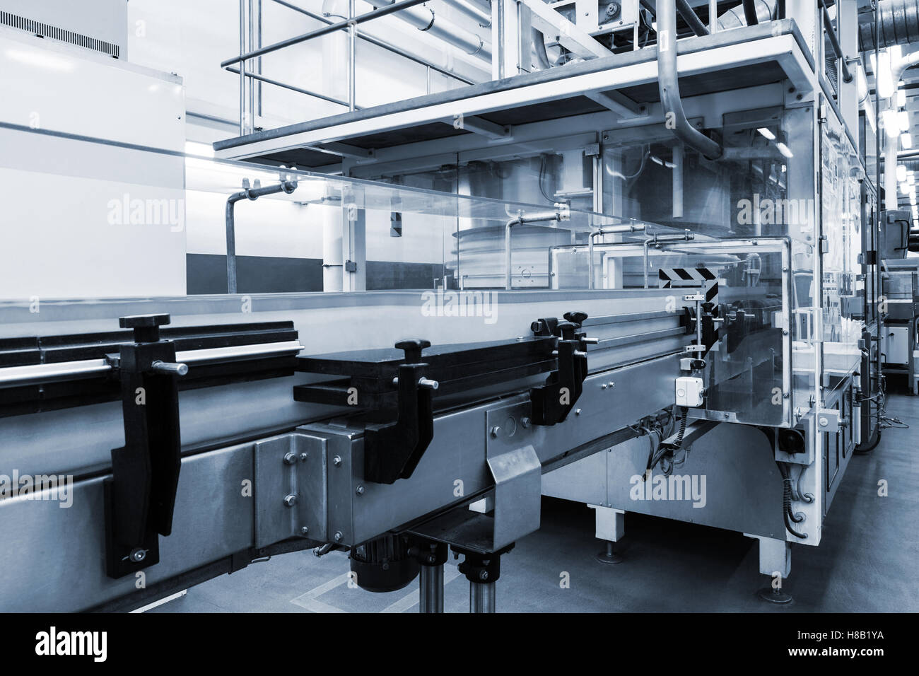 conveyor working at a modern plant Stock Photo - Alamy