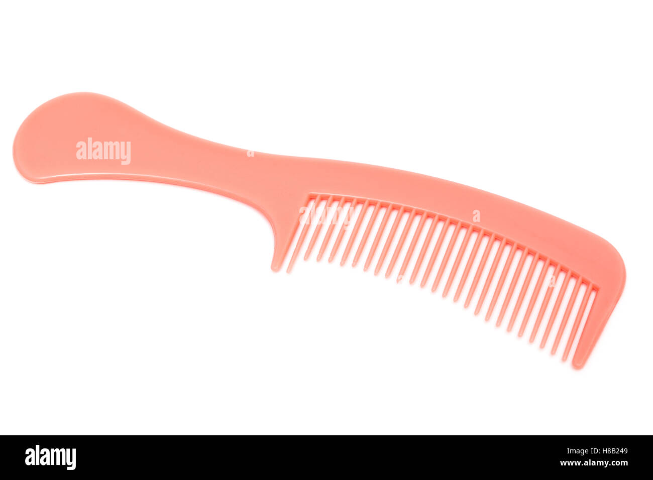 pink comb on a white background Stock Photo - Alamy