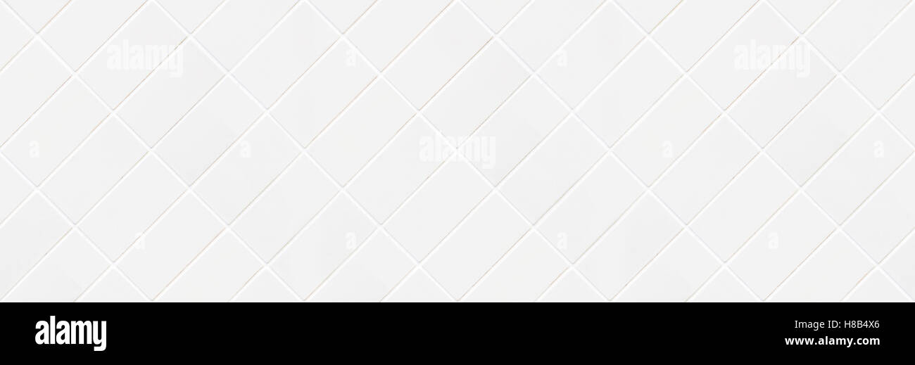 closeup of white ceramic rhomboid mosaic wall with tiles in shape of ...