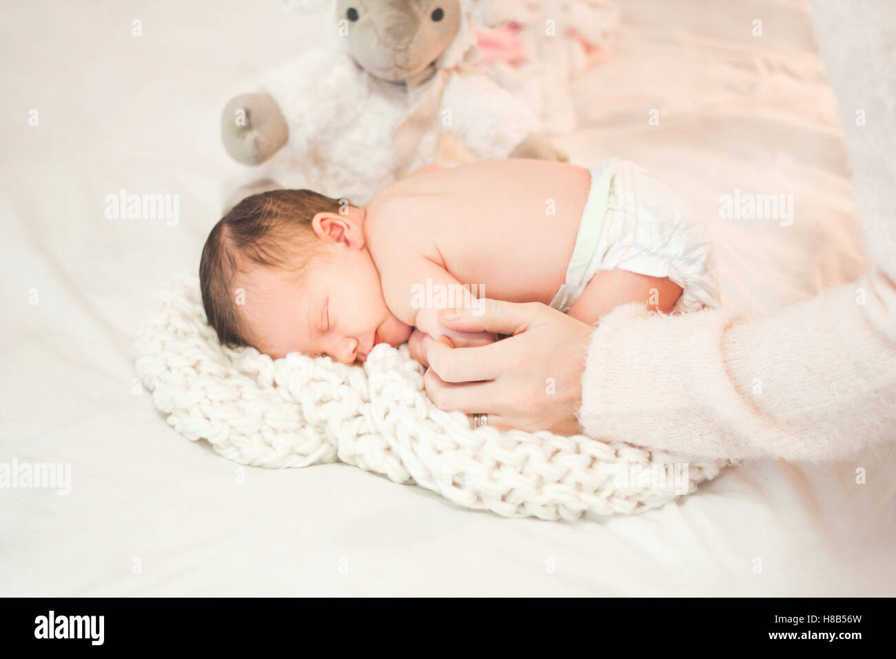 Mother caring for newborn baby Stock Photo - Alamy