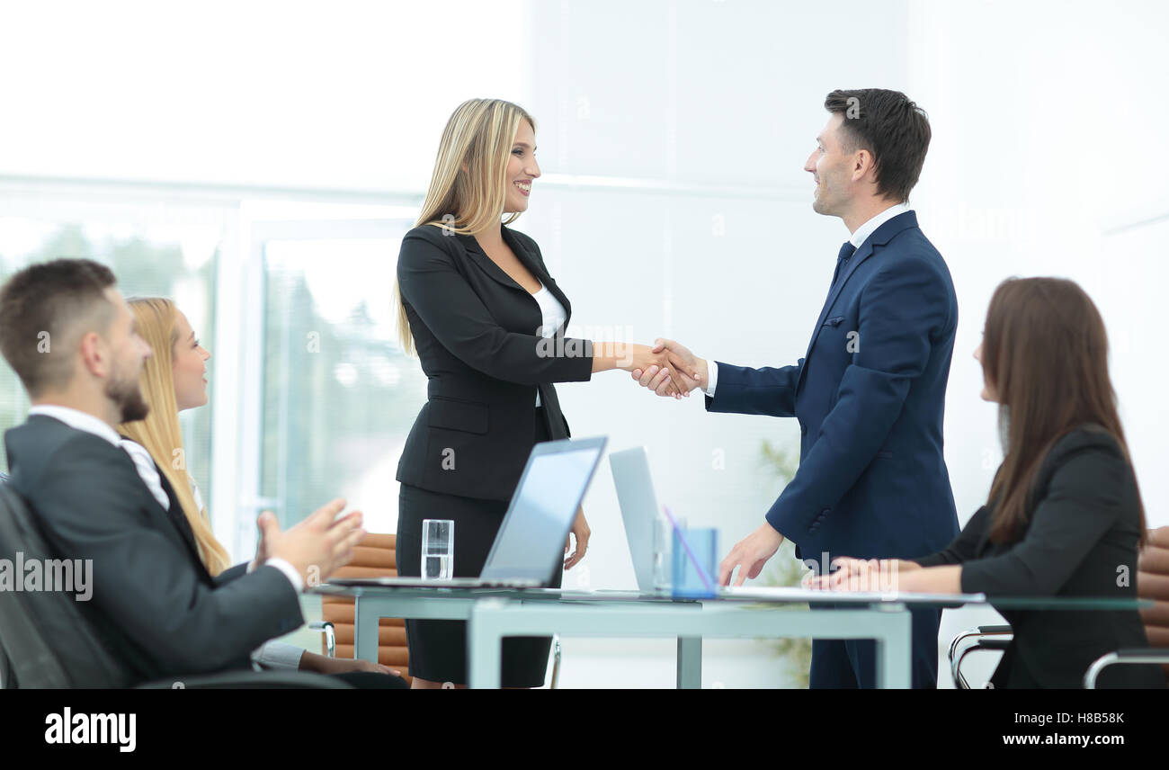 Business partner greeting each other with handshake Stock Photo - Alamy