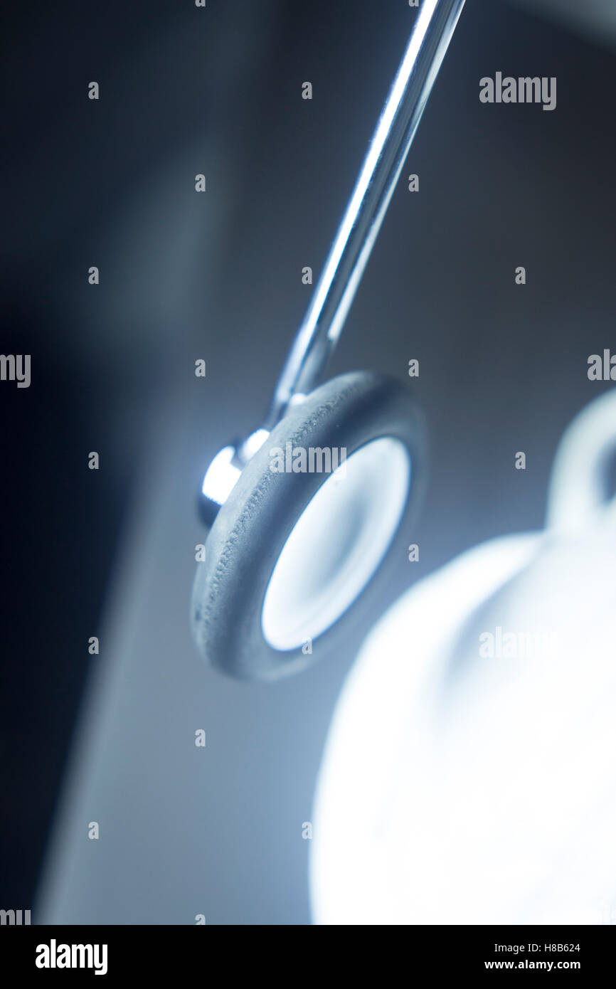 Doctor's reflex hammer tool used to test patient reflexes in knee and ...