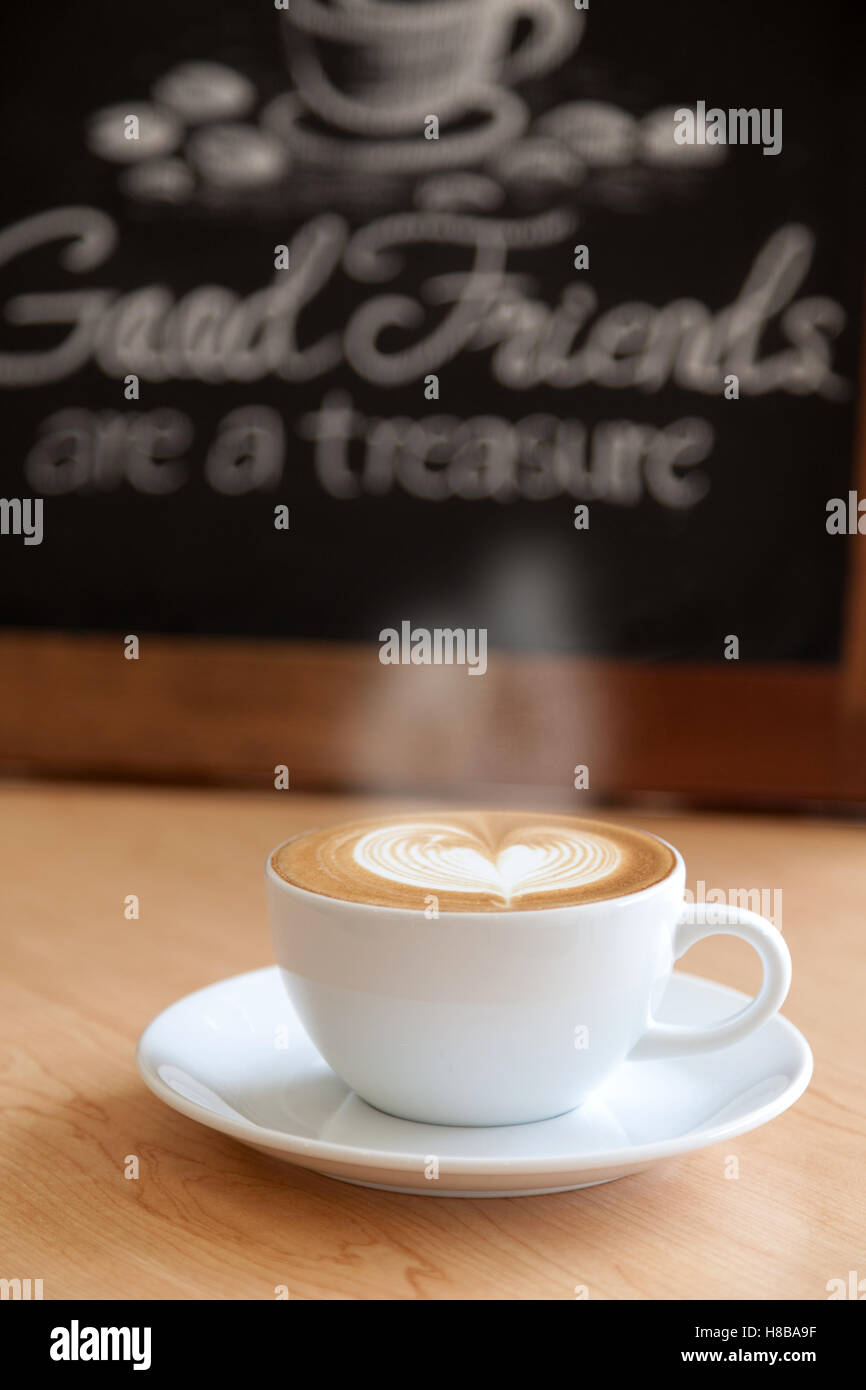 Good cup of coffee and good quote behind Stock Photo - Alamy