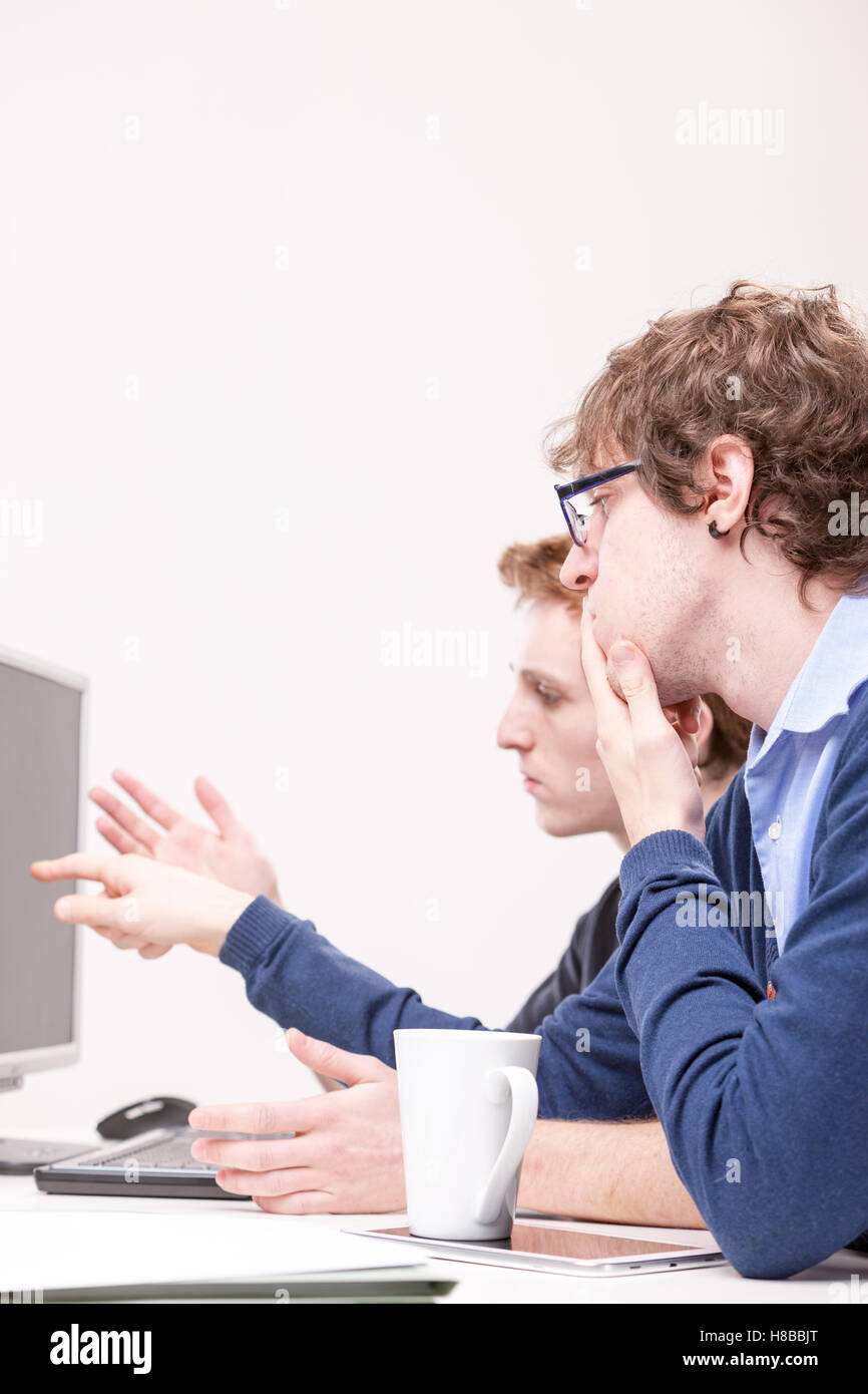 men doing teamwork in their office in front of an EMPTY (free for your ...