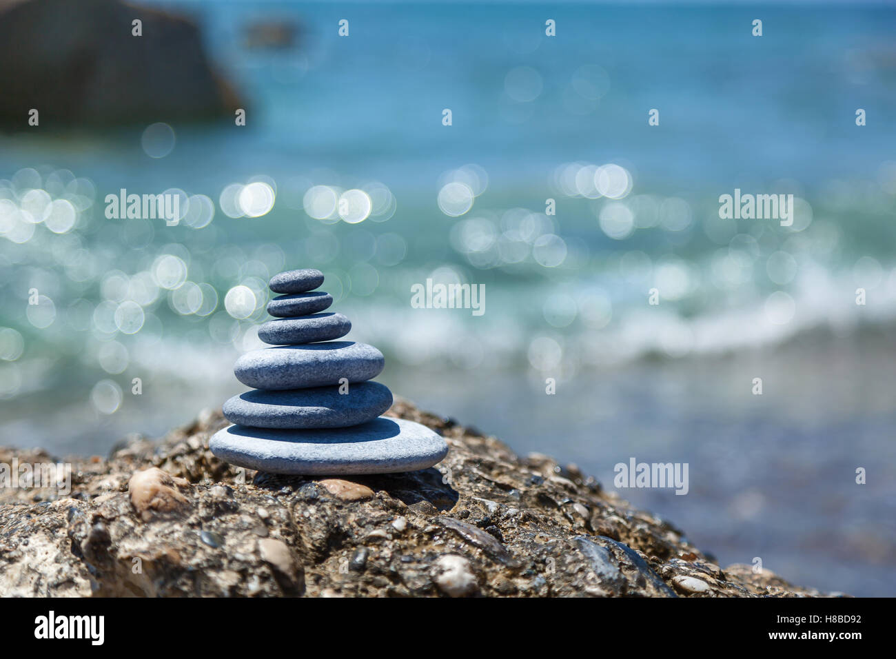 A small Zen out of a pile of stones on a rock,Stone balance Stock Photo ...