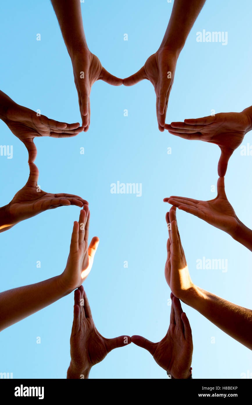 Hands forming cross hi-res stock photography and images - Alamy