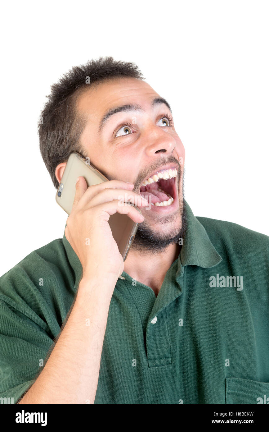 young man with cellphone doing funny faces isolated in white Stock ...