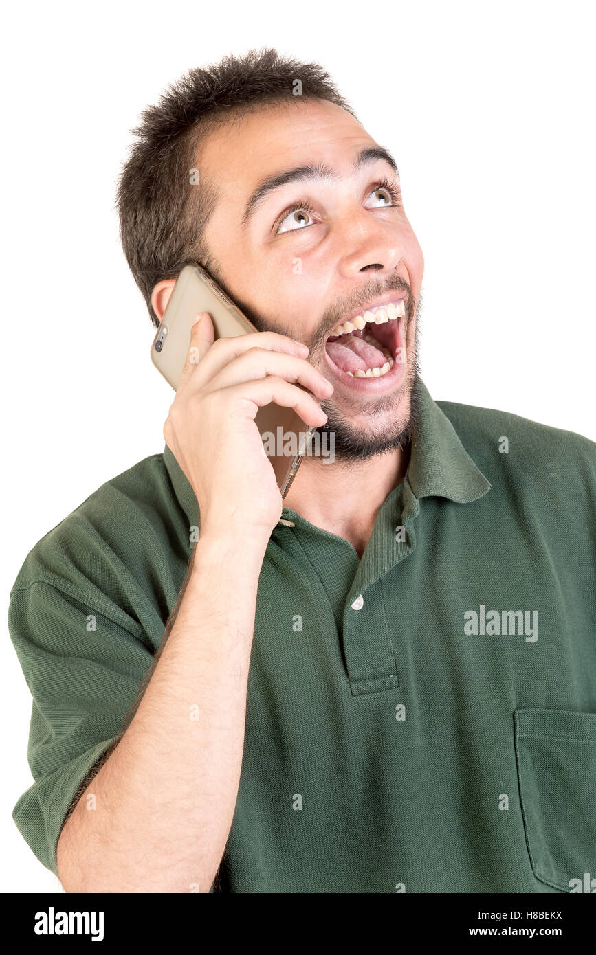 young man with cellphone doing funny faces isolated in white Stock ...