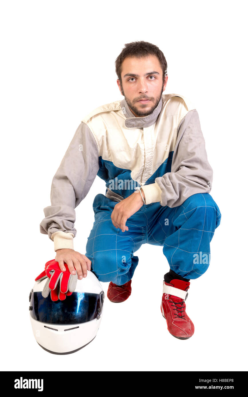 Racing driver posing with helmet isolated in white Stock Photo - Alamy