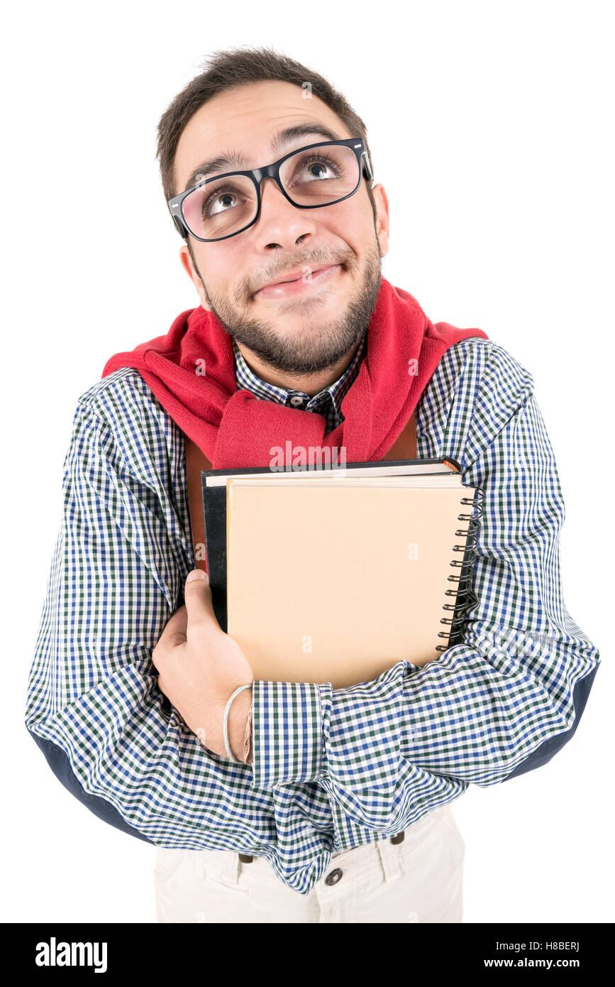 Young nerd student posing with books isolated in a white background ...