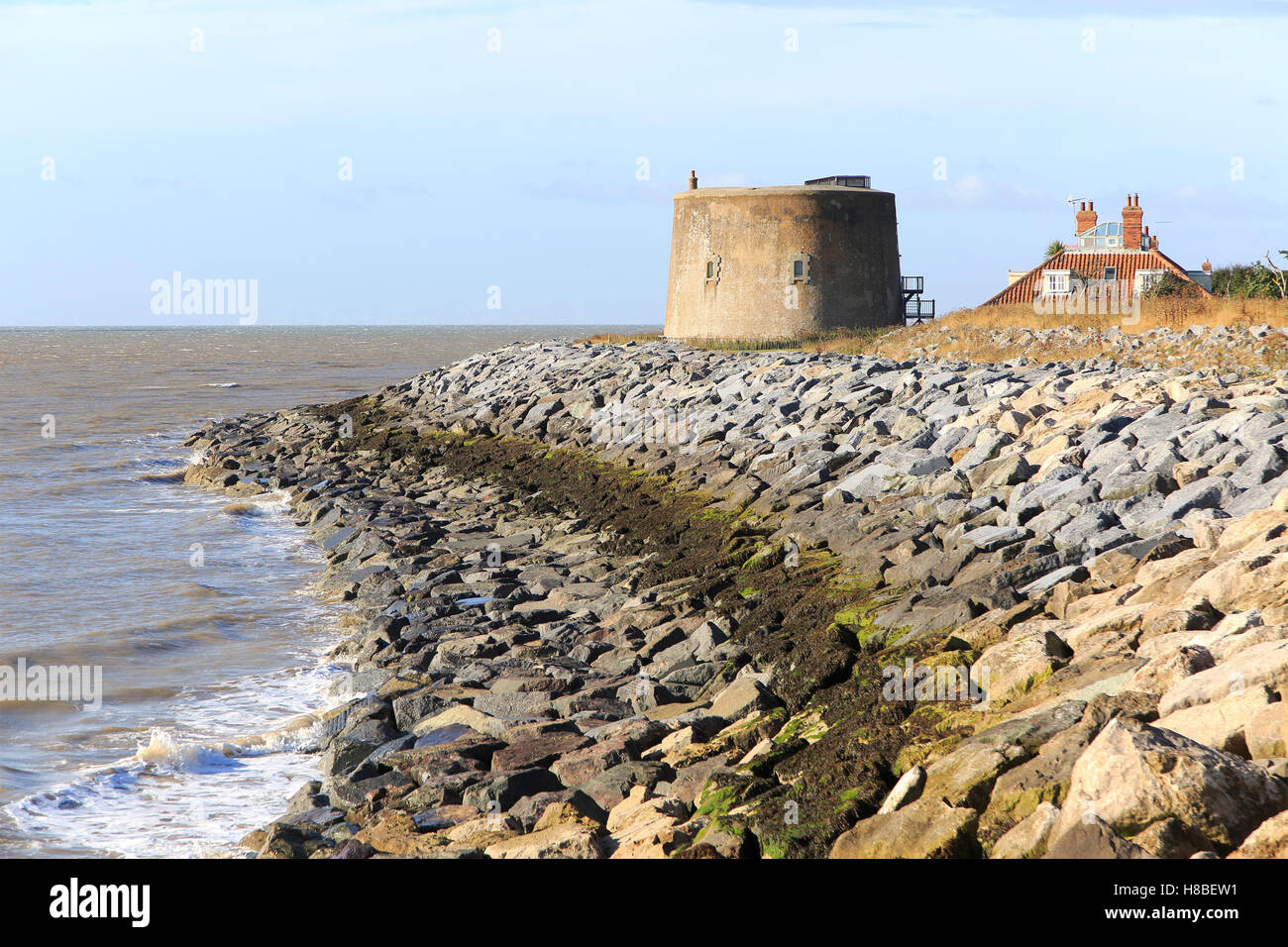 Martello tower W defended by rock armour from coastal erosion, East ...