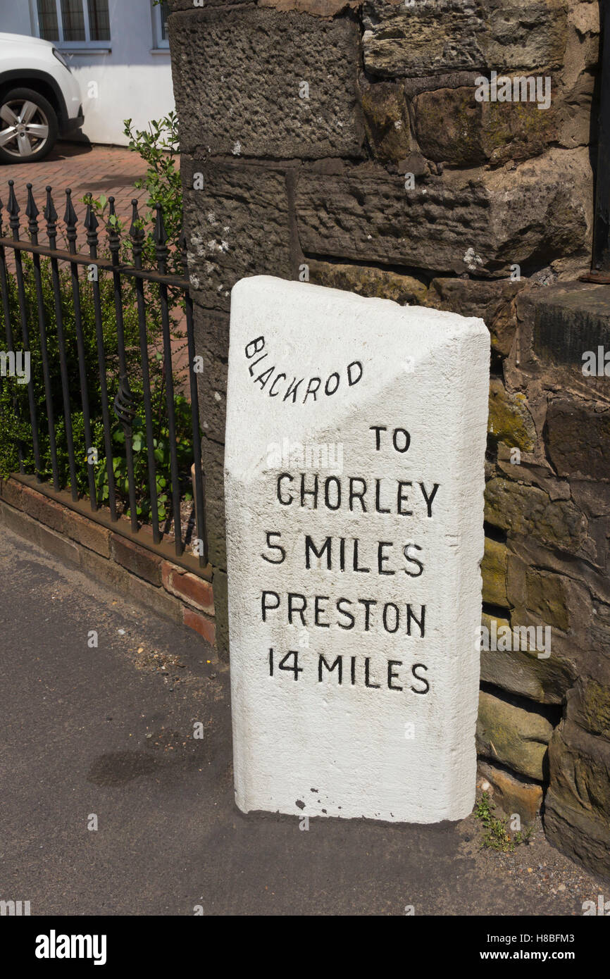 Milestone in the village of Blackrod, near Bolton, Lancashire, showing ...