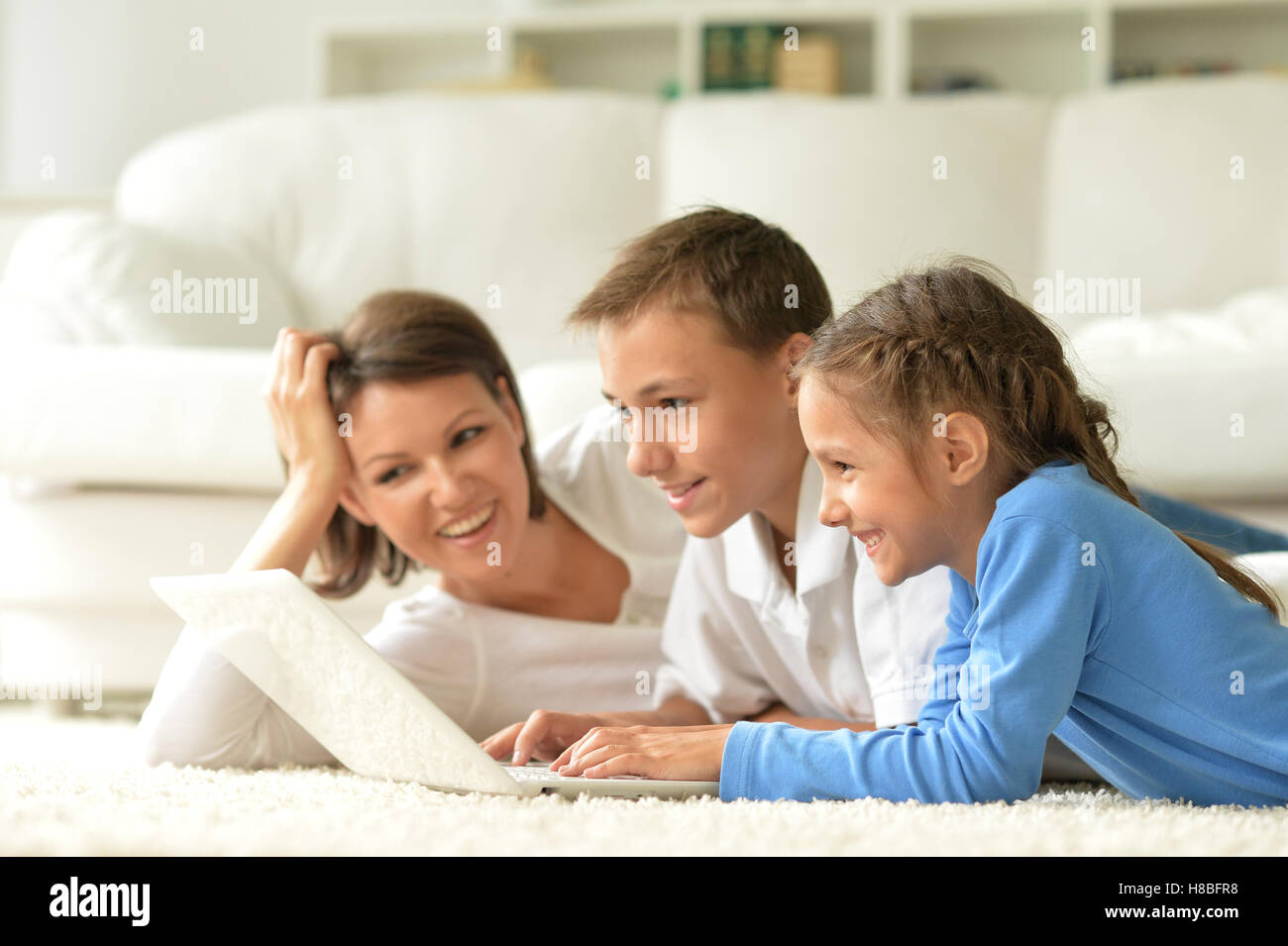 portrait of happy Family with laptop Stock Photo - Alamy