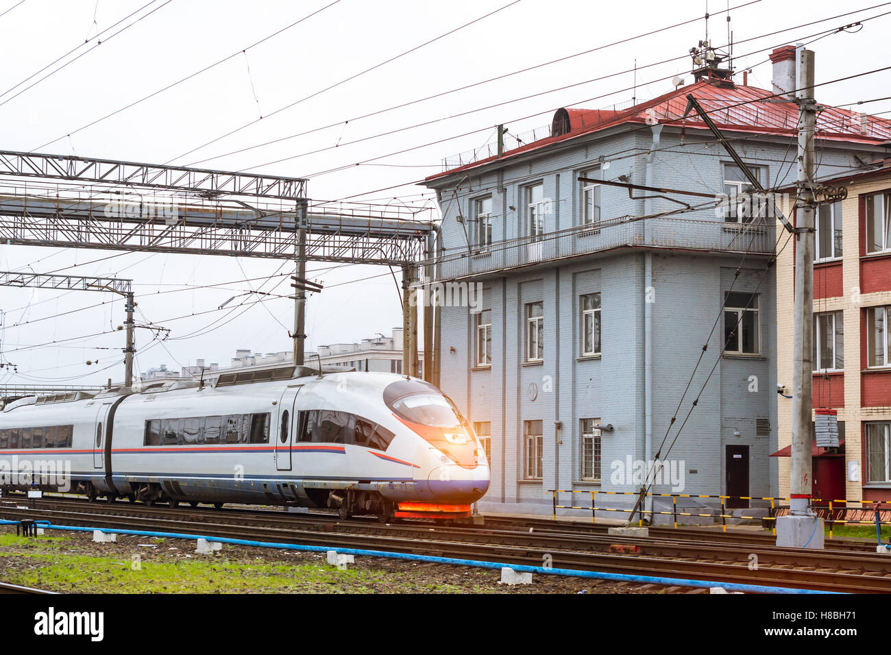 Modern hybrid electric locomotive Sapsan pulling a high-speed train ...