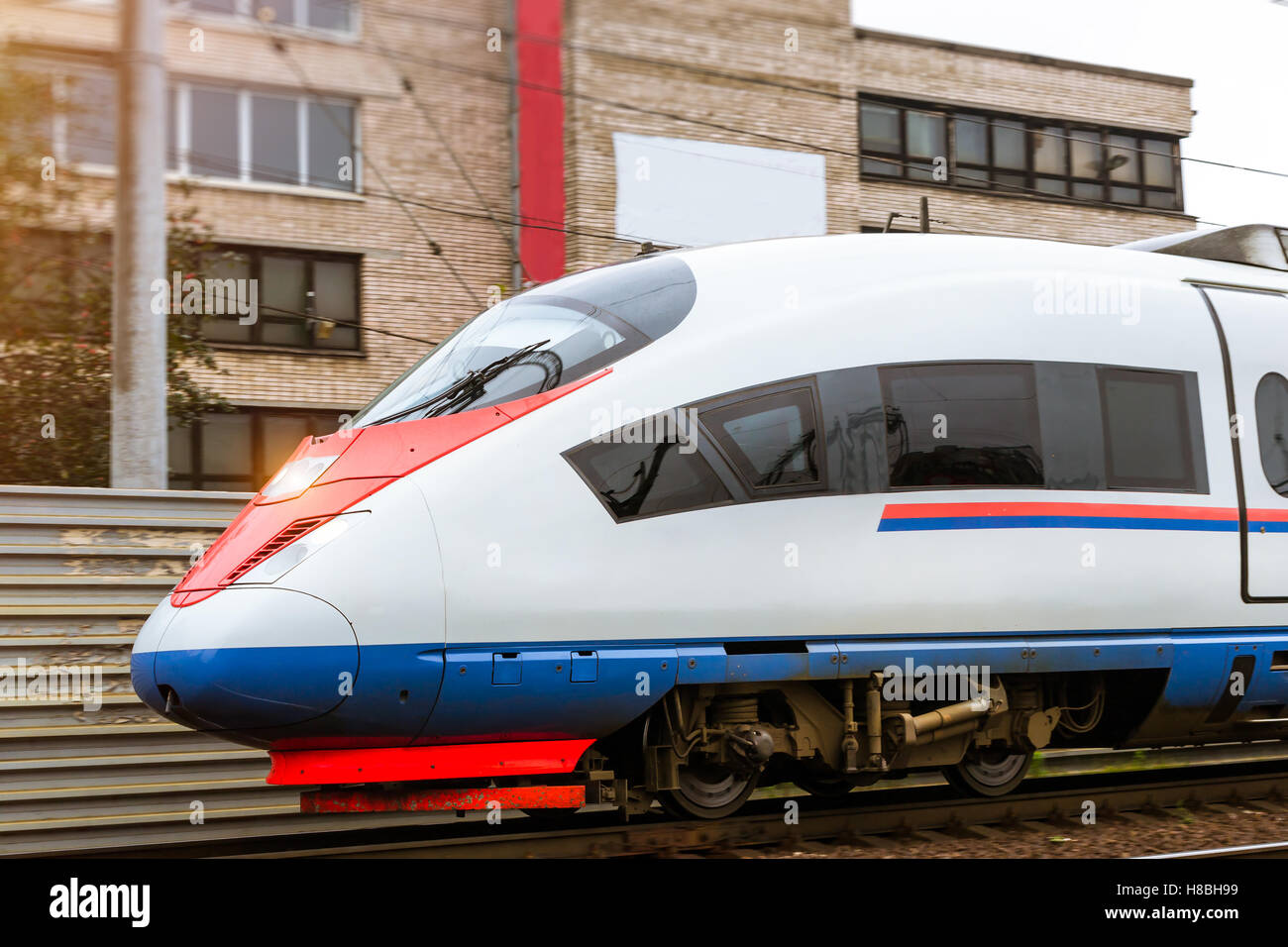Modern hybrid electric locomotive Sapsan pulling a high-speed train ...