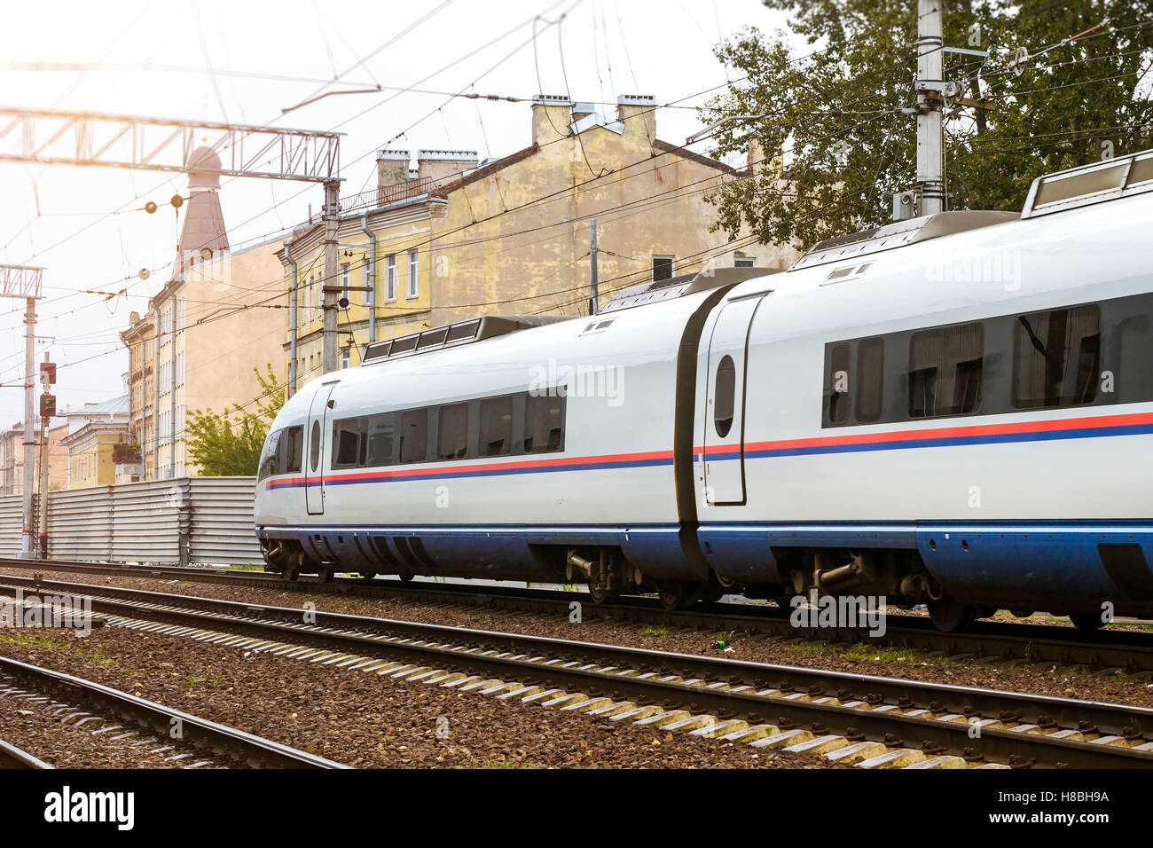 Modern hybrid electric locomotive Sapsan pulling a high-speed train ...