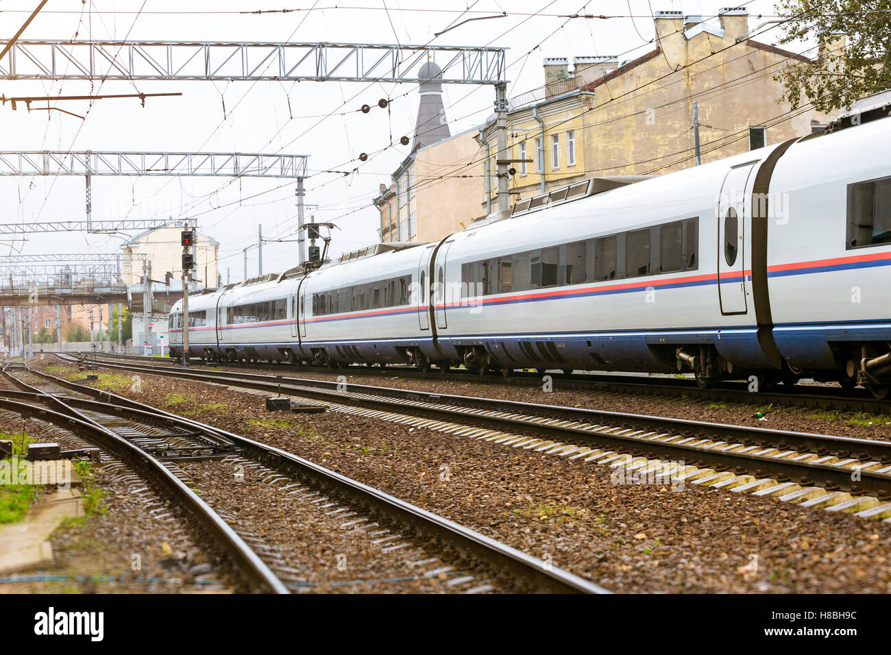 Modern hybrid electric locomotive Sapsan pulling a high-speed train ...