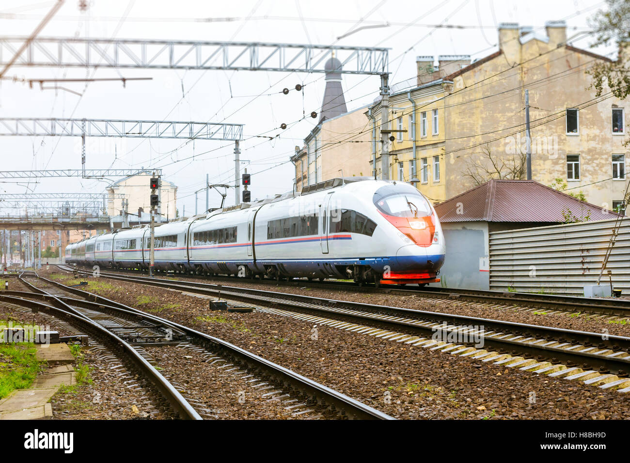 Modern hybrid electric locomotive Sapsan pulling a high-speed train ...
