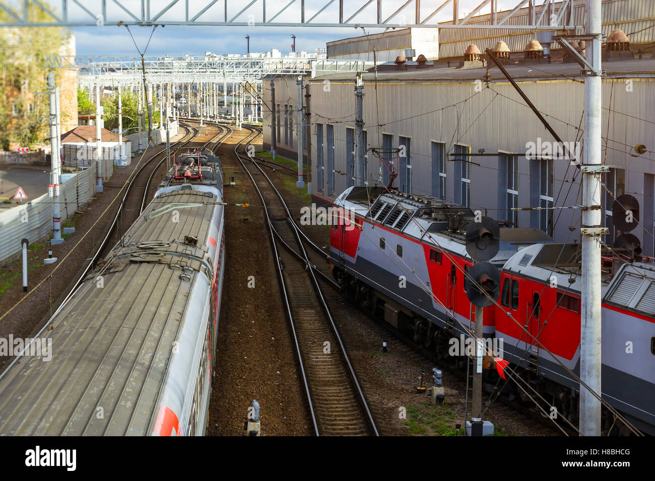 Electric locomotive pulling high-speed train on rails. Technical ...