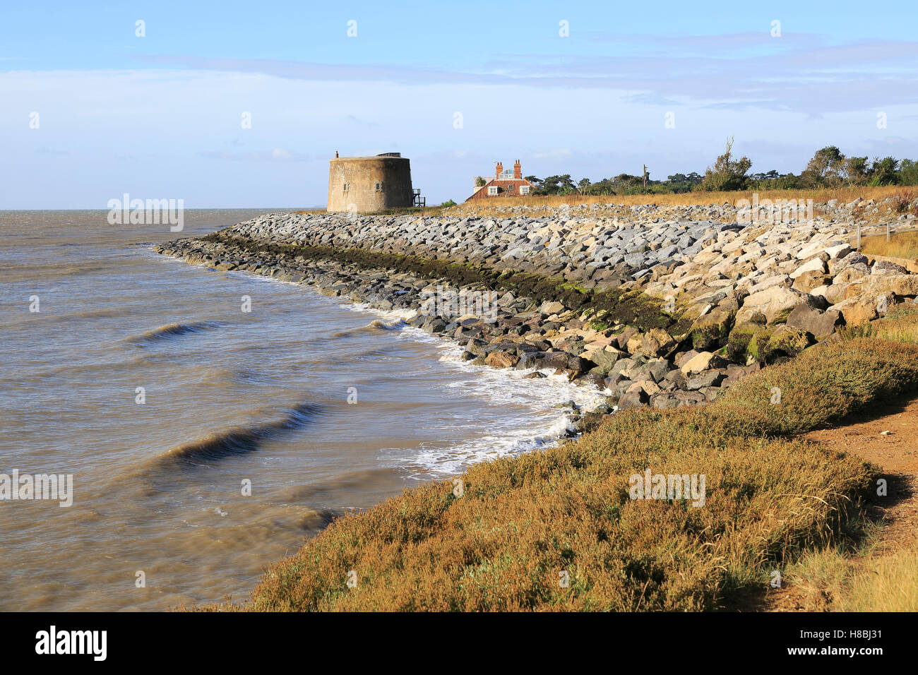 Martello tower W defended by rock armour from coastal erosion, East ...