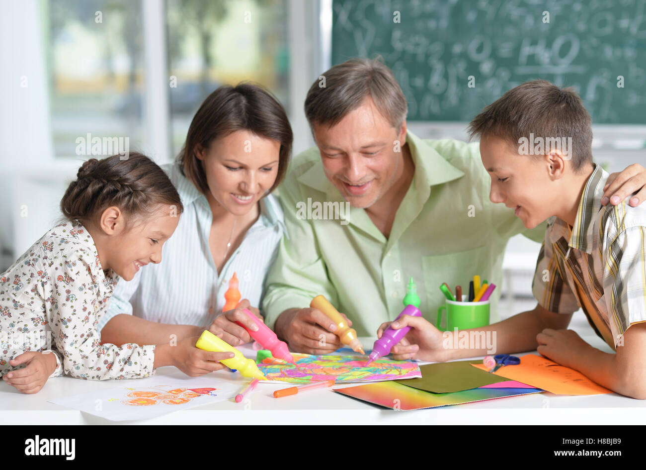 Happy family drawing Stock Photo - Alamy