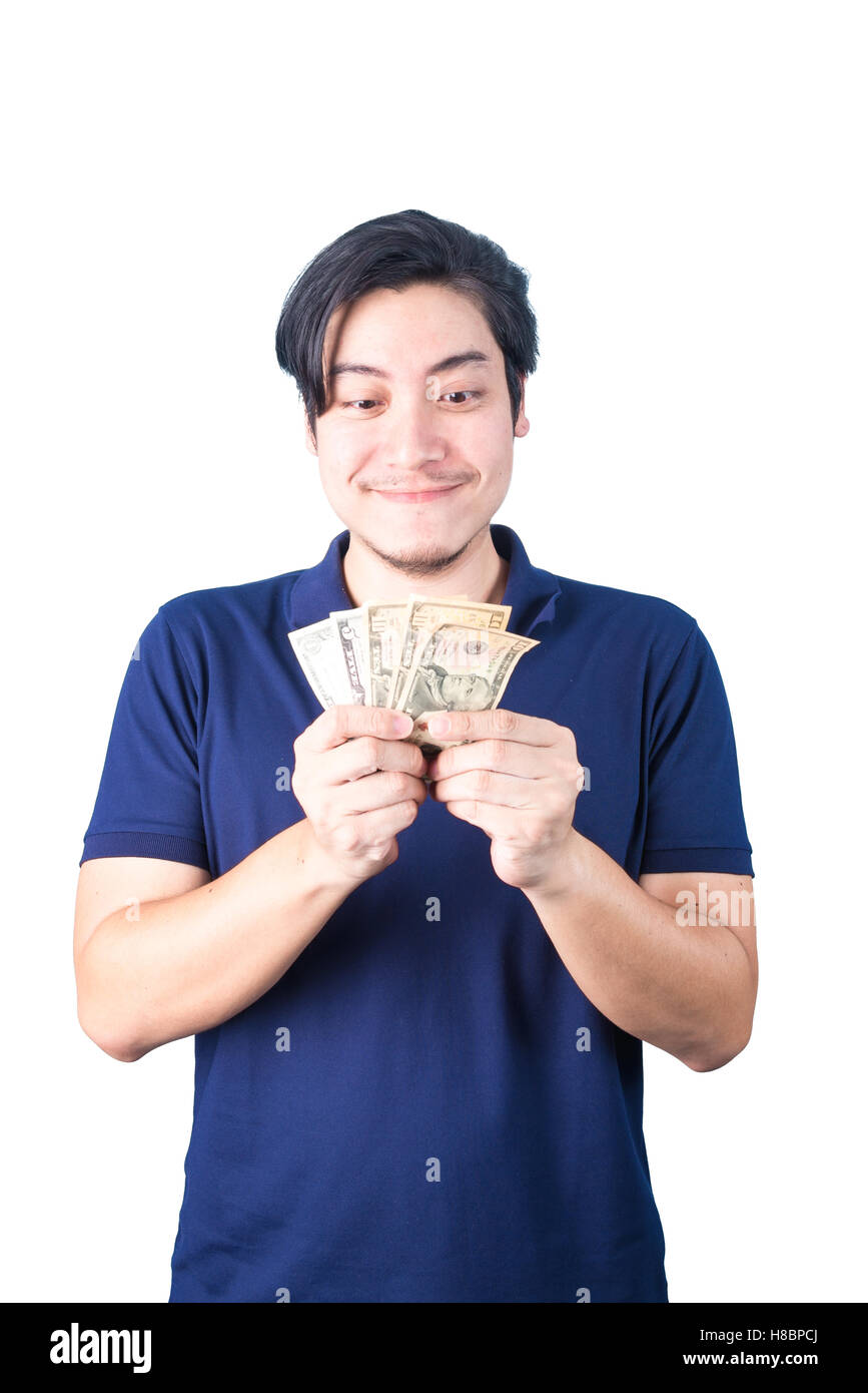 Successful Asian man. Happy young man holding money while standing and ...