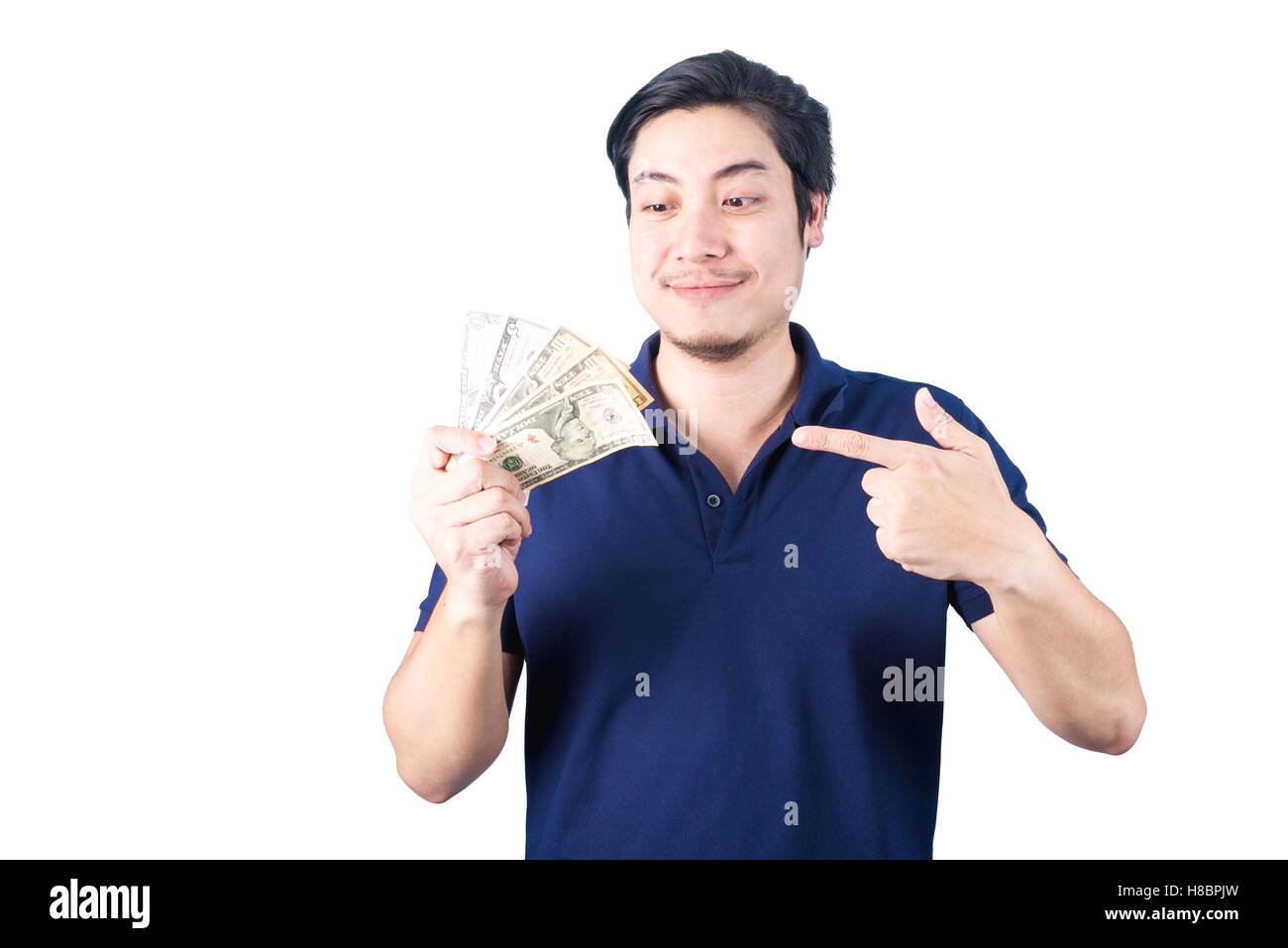 Successful Asian man. Happy young man holding money while standing and ...