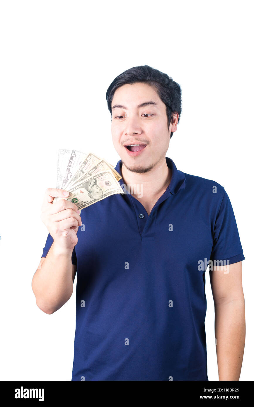 Successful Asian man. Happy young man holding money while standing and ...