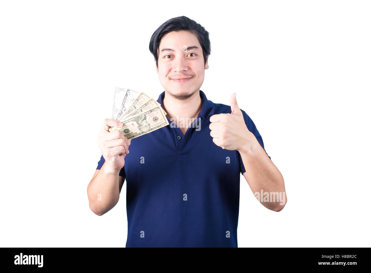 Successful Asian man. Happy young man holding money while standing and ...