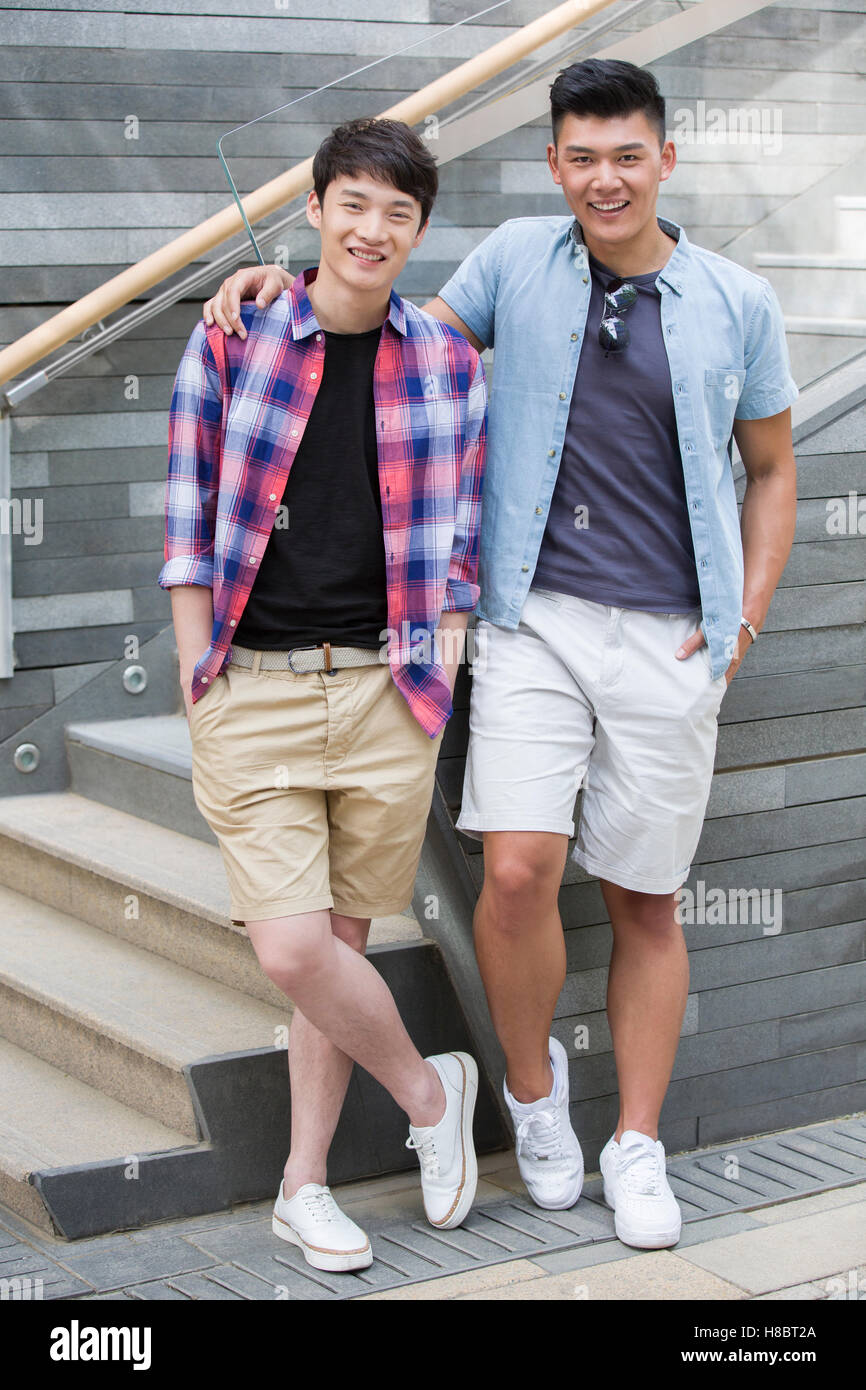 Portrait of happy young Chinese friends Stock Photo - Alamy