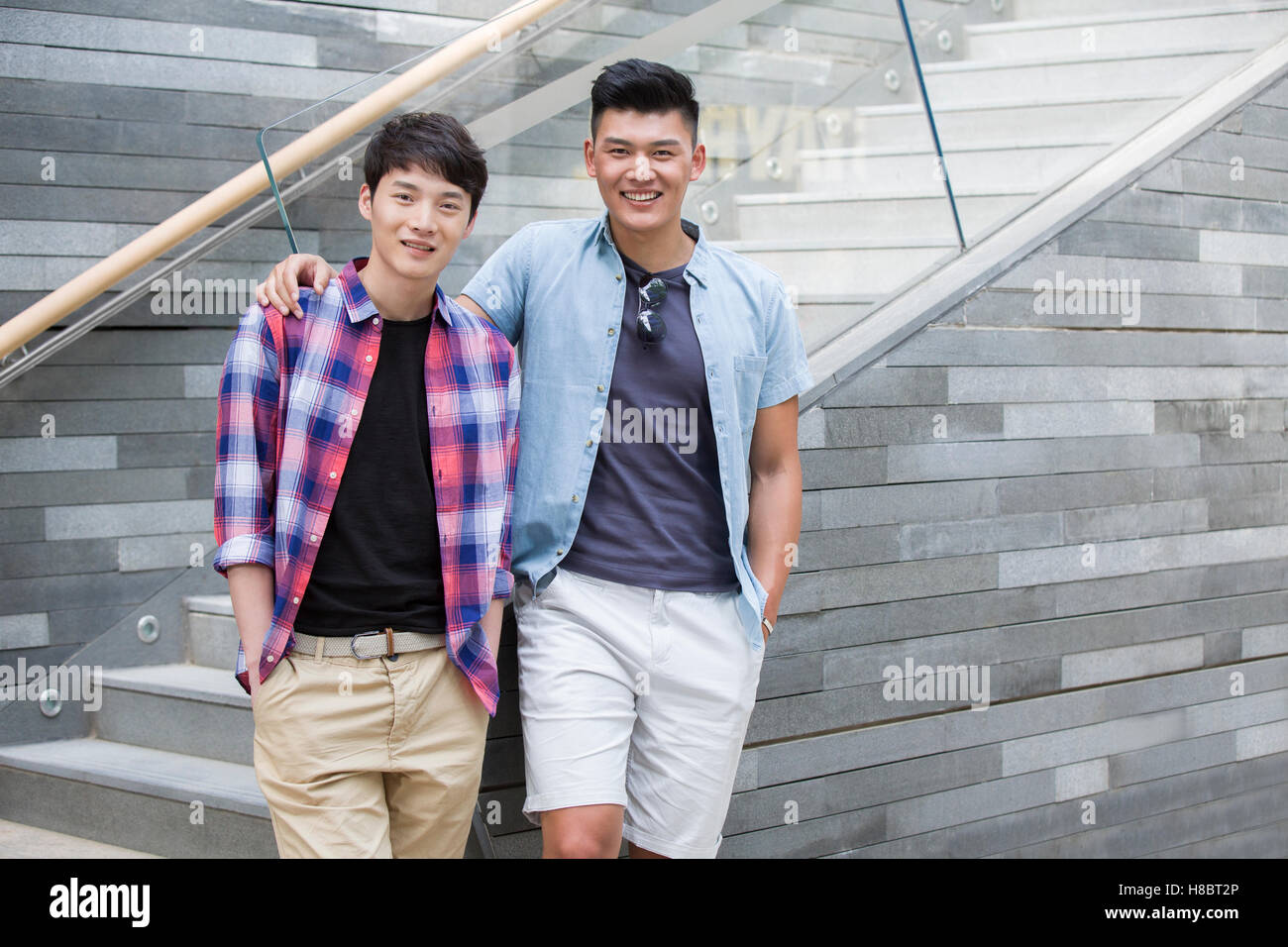 Portrait of happy young Chinese friends Stock Photo - Alamy