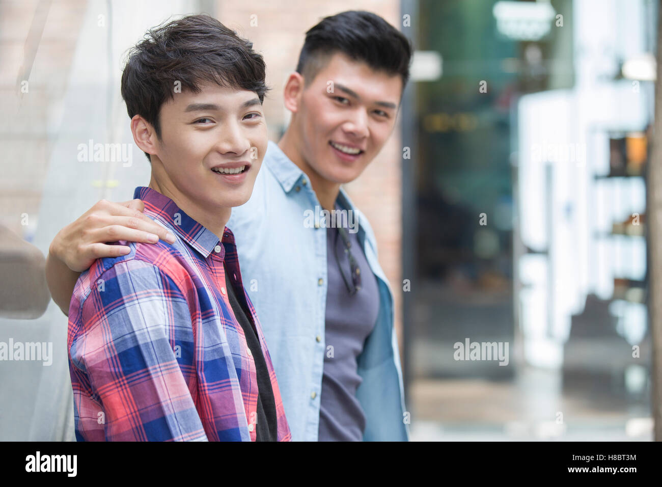Portrait of happy young Chinese friends Stock Photo - Alamy