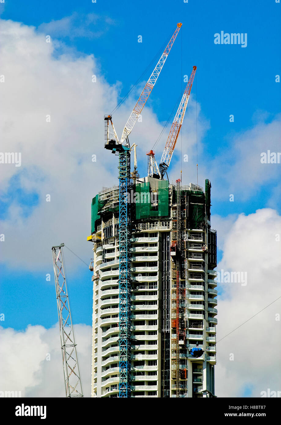 Cranes at work on high-rise apartment building on Queensland's Gold ...