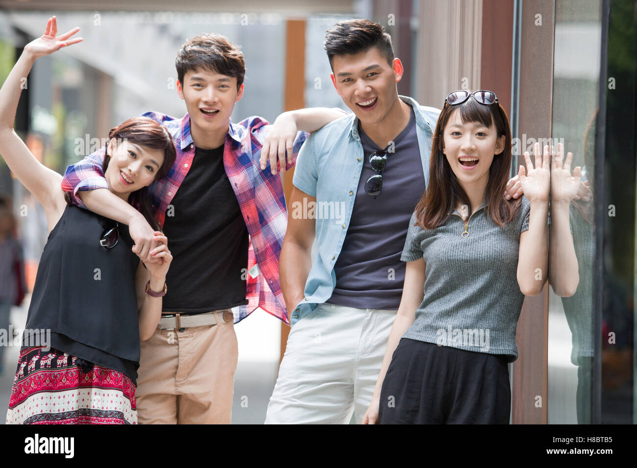 Portrait of happy young Chinese friends Stock Photo - Alamy
