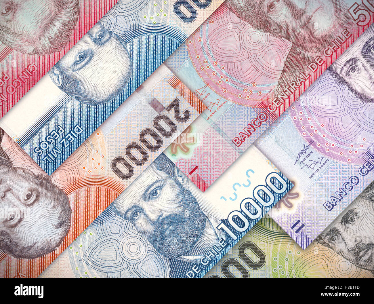Different money bills stacked over each other forming a money ...