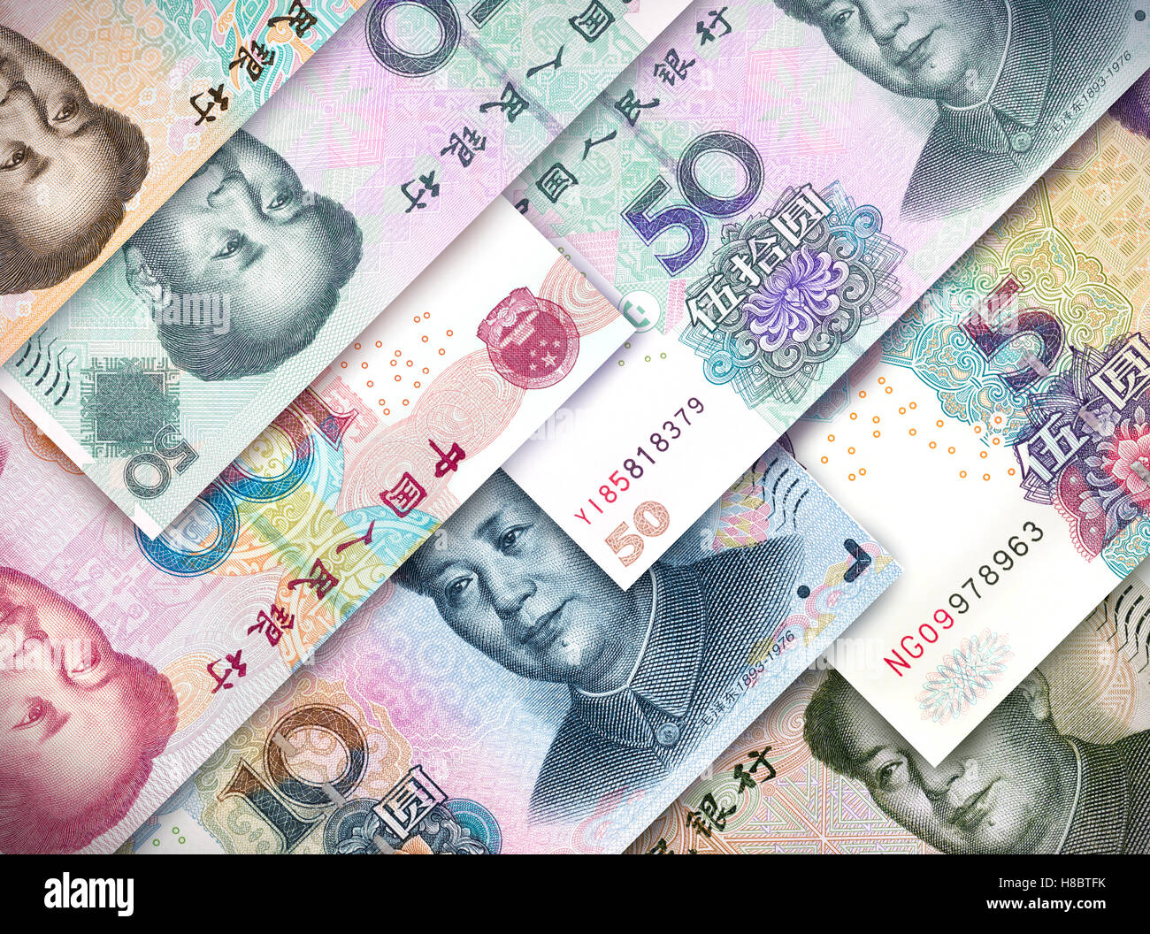 Different money bills stacked over each other forming a money ...