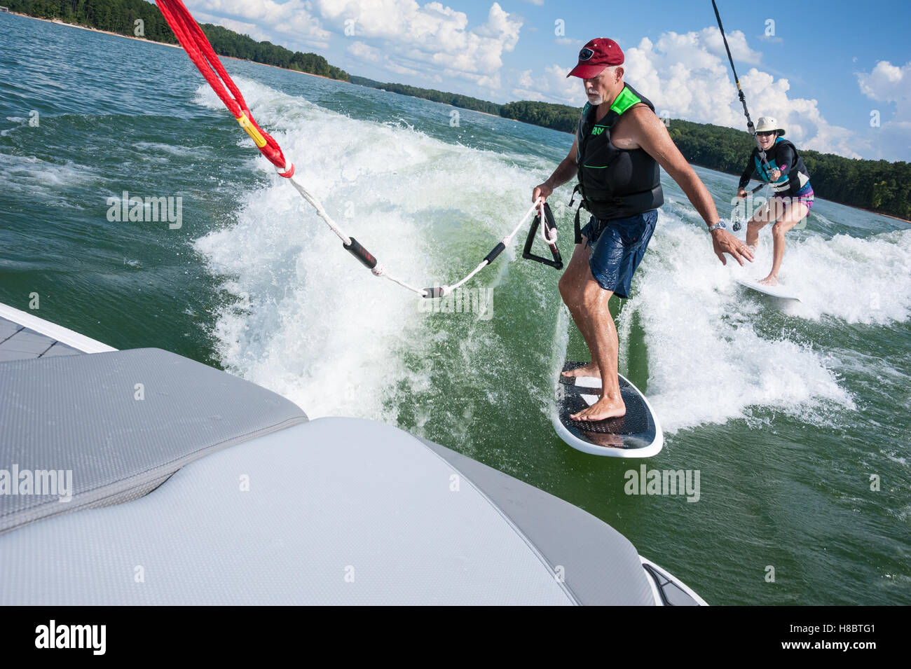 Senior couple enjoying a day of wake surfing together on Lake Hartwell ...