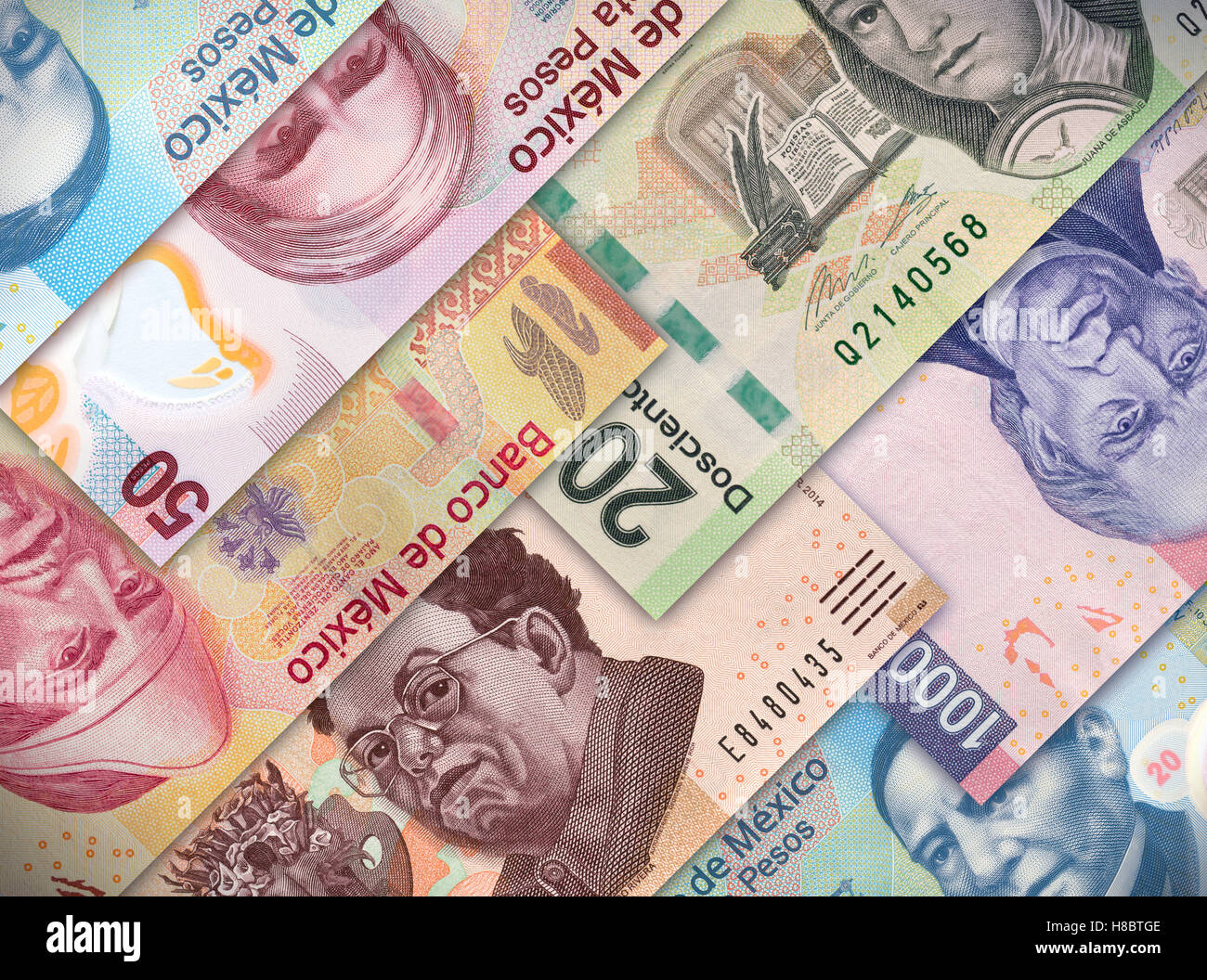 Different money bills stacked over each other forming a money ...