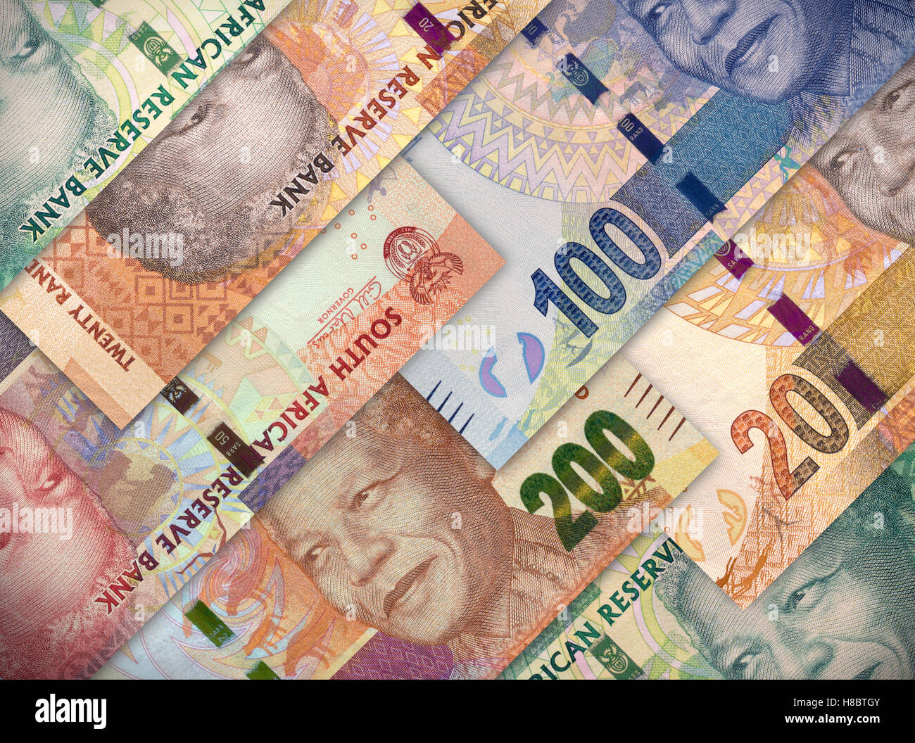 Different money bills stacked over each other forming a money ...