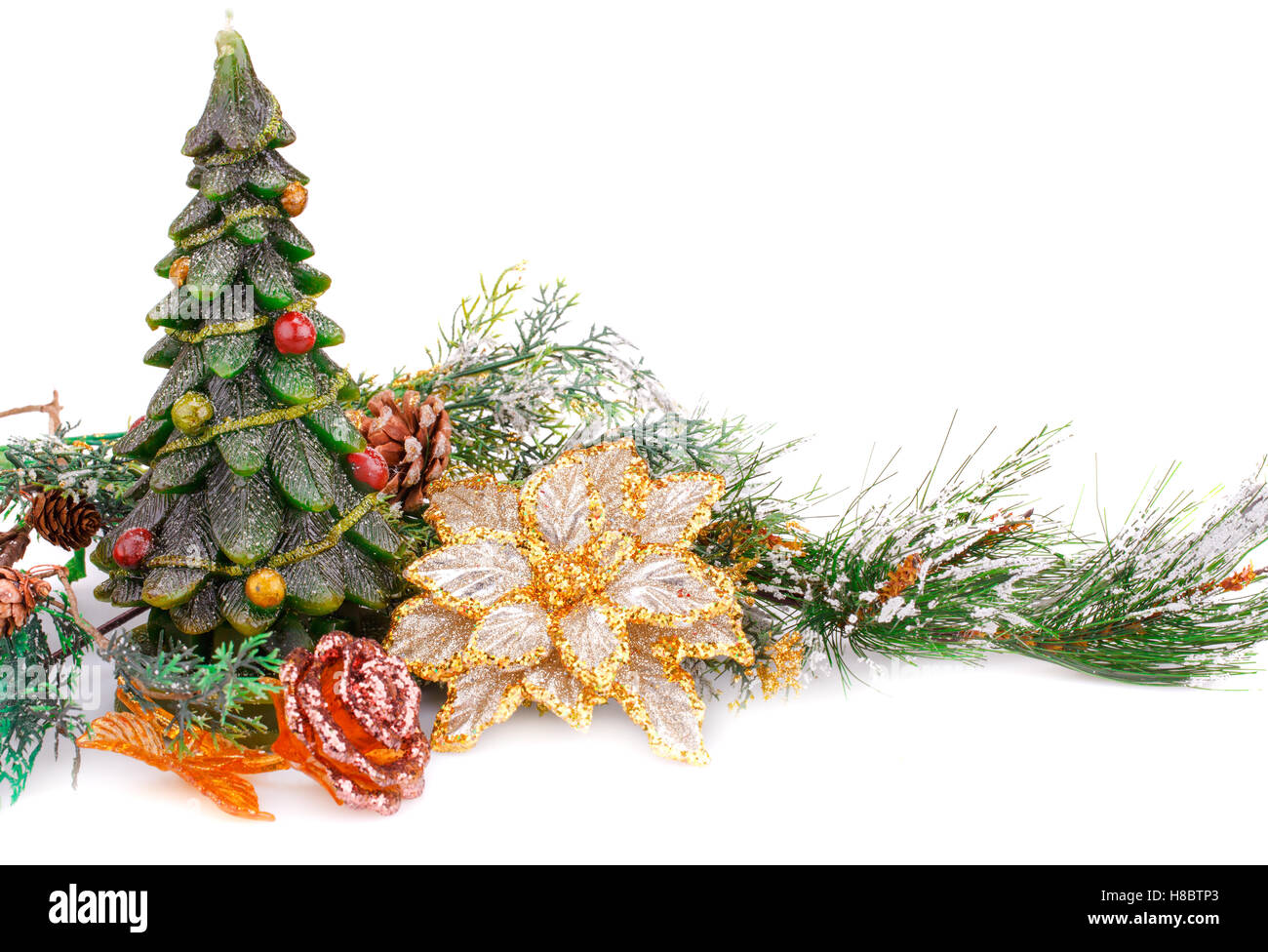 Fir tree candle and flowers on white background Stock Photo - Alamy