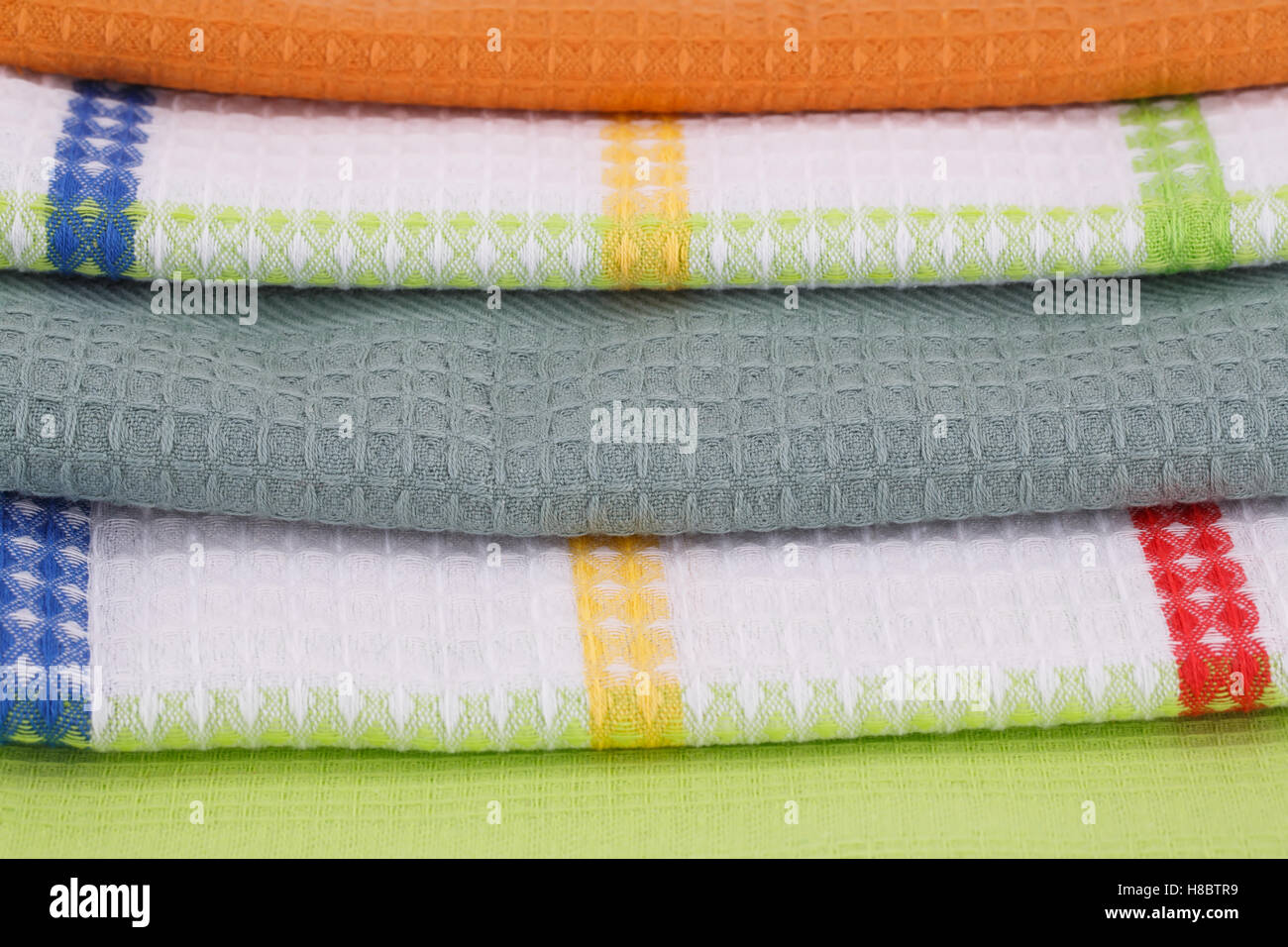 Stack of colorful kitchen towels closeup picture Stock Photo - Alamy