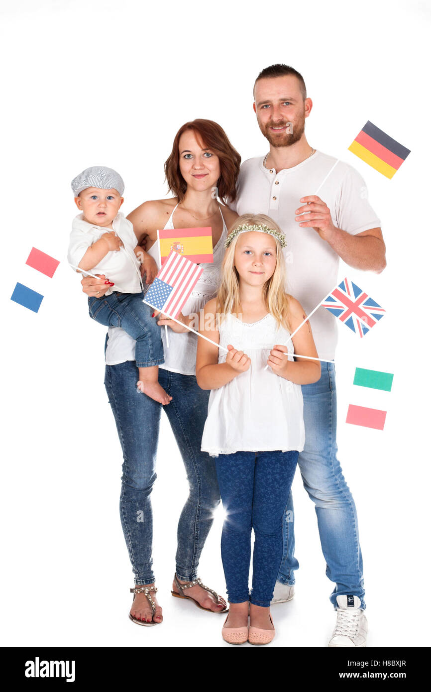 group of people- family holding a flag and looking at the camera ...