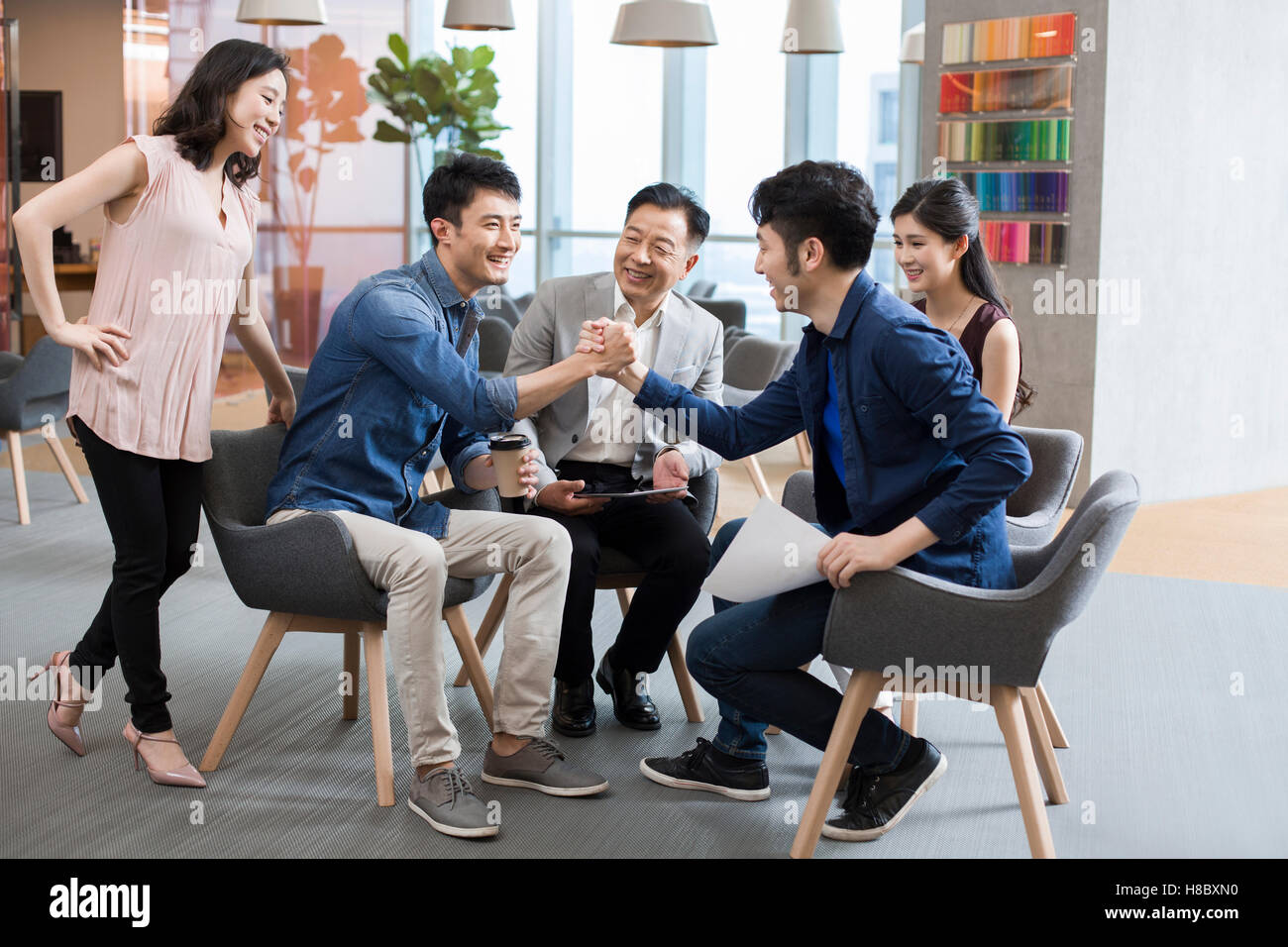 Chinese business people cheering Stock Photo - Alamy
